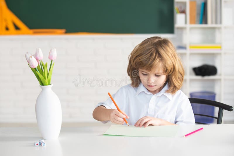 School Boy with Writing Lesson. Kids in Classroom at School. Stock ...