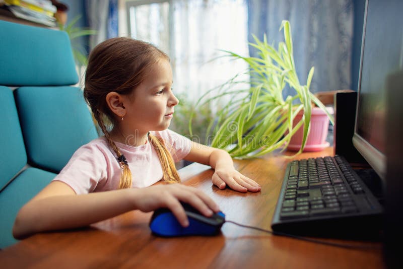 School Child Sitting at Home and Playing Computer Stock Photo - Image ...