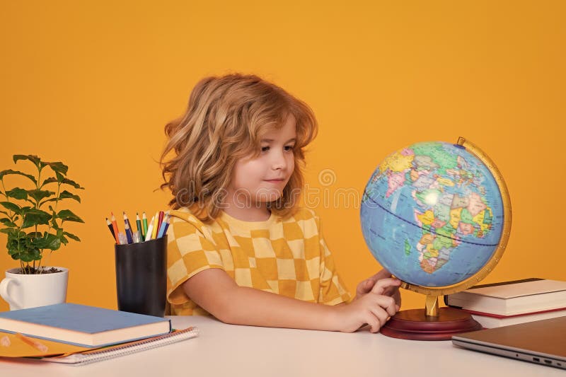 School Child Student Learning in Class Looking at Globe during ...