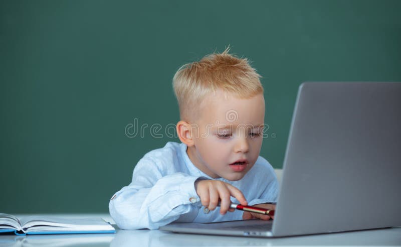 School Child Using Digital Pc Laptop in Class. Portrait of Funny Pupil ...
