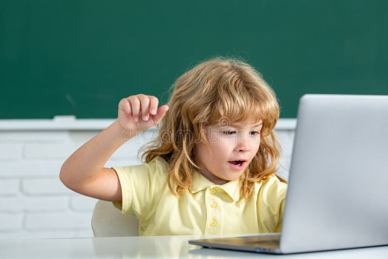 School Child Using Digital Pc Laptop in Class. Portrait of Funny Pupil ...