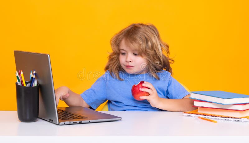 School Child Using Laptop Computer. Nerd School Kid Isolated on Studio ...