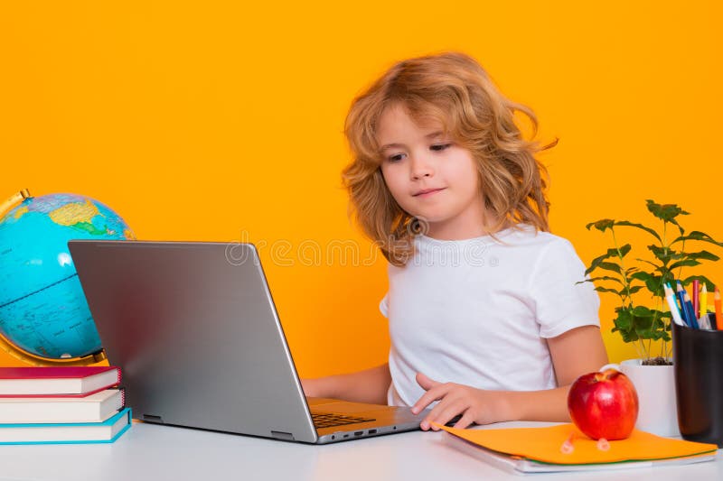 School Child Using Laptop Computer. School Child 7-8 Years Old with ...