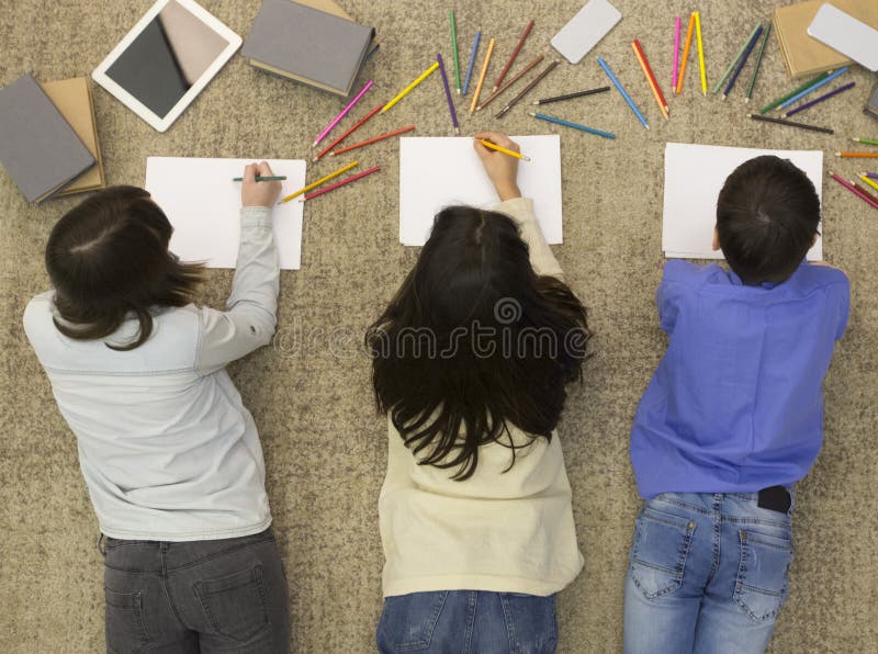 School Children Drawing with Colored Pencils on Carpet Stock Photo ...