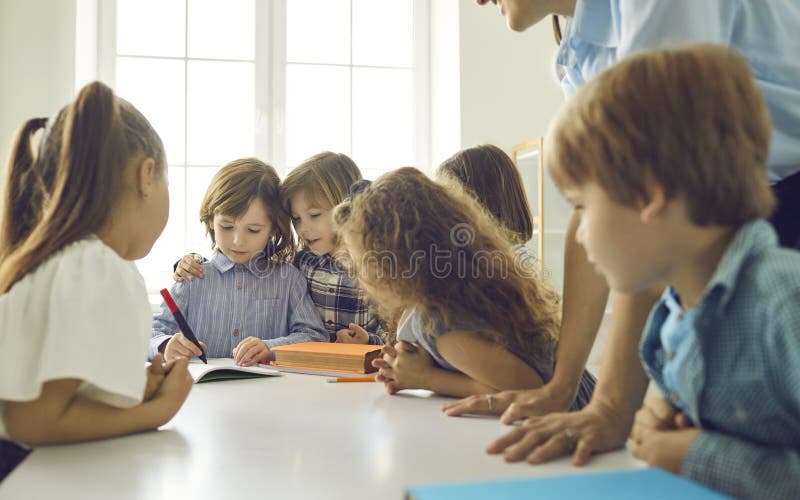 Children Helping Each Other Classroom Stock Photos - Free & Royalty ...