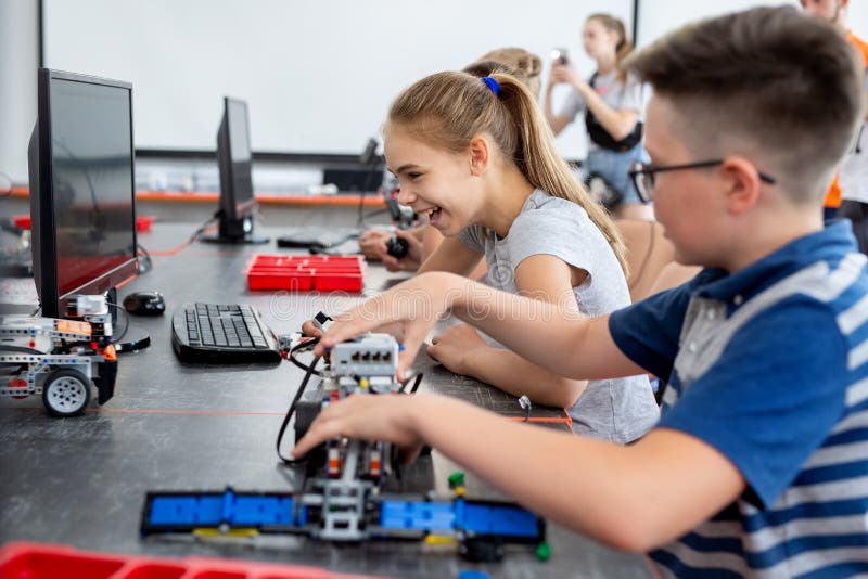 School Children Programs a Robot in the Classroom. Stock Photo - Image ...