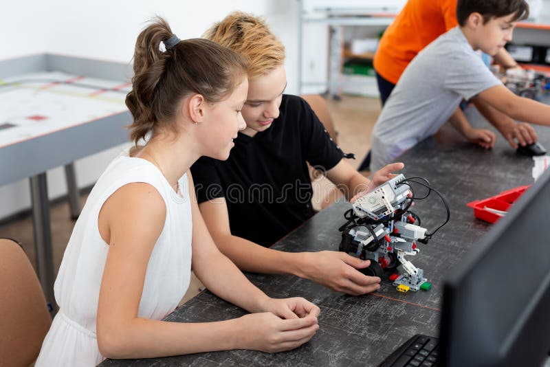 School Children Programs a Robot in the Classroom. Stock Photo - Image ...