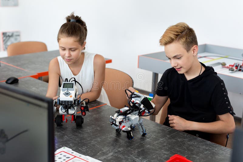 School Children Programs a Robot in the Classroom. Stock Photo - Image ...