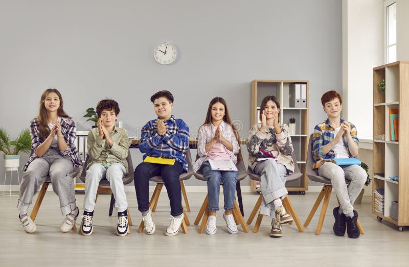 School Children Sitting in the Classroom and Applauding after an ...