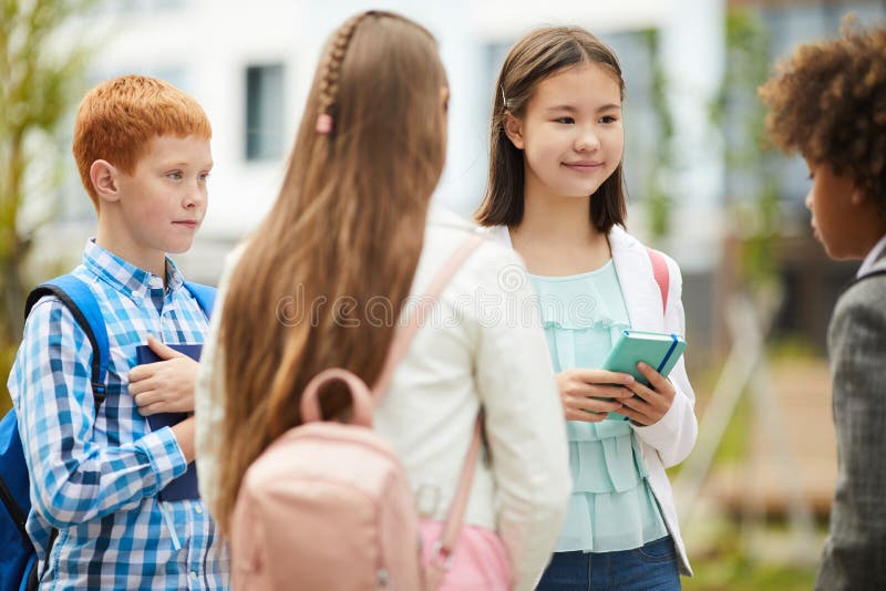 School Children Standing Outdoors Stock Photo - Image of holding ...