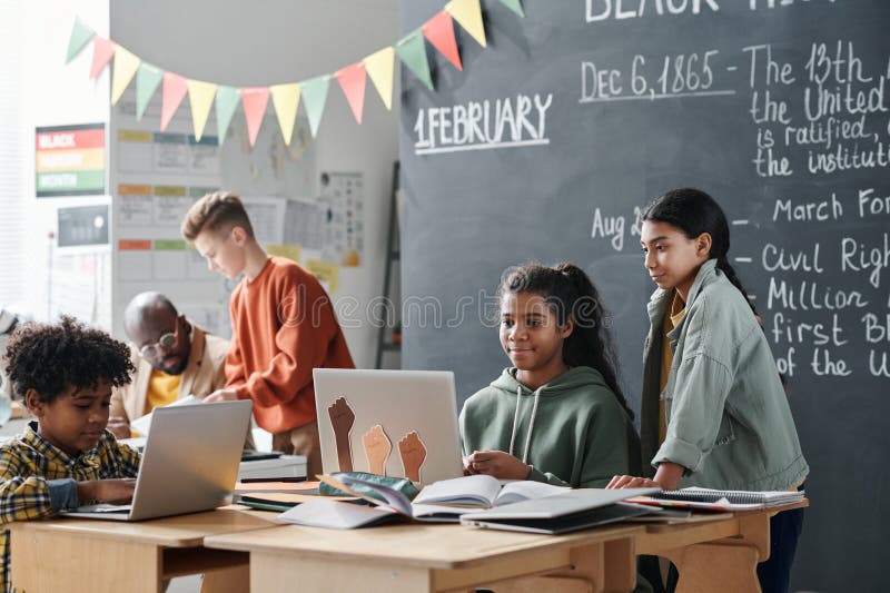 School Children Working with Teacher in Team Stock Image - Image of ...