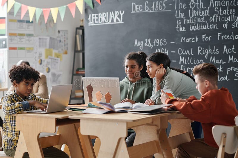 School Children Working with Teacher in Team Stock Image - Image of ...