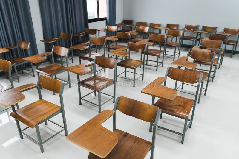 School Classroom with Many Wooden Chairs Well-arranged in Rows with No ... School Classroom with Many Wooden Chairs Well-arranged in Rows with No ...