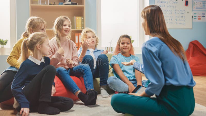 School Creativity Class: Children Sitting on the Bean Bags while Caring ...