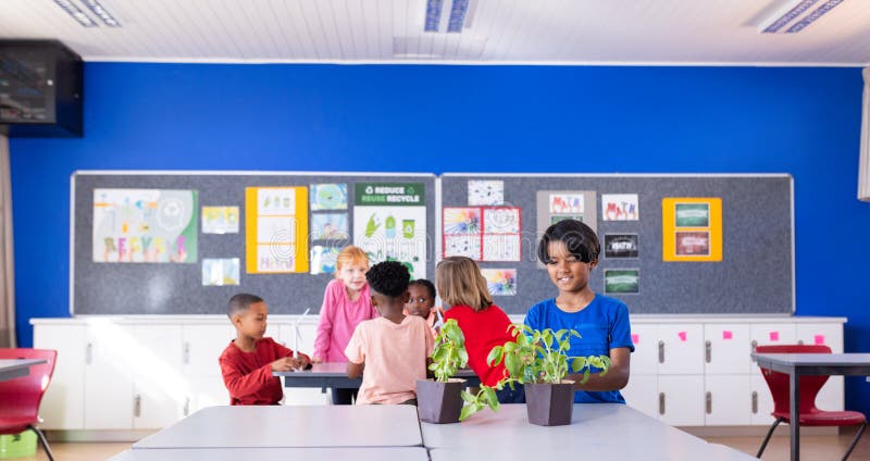 In School, Diverse Children Working Together on Plant Project in ...