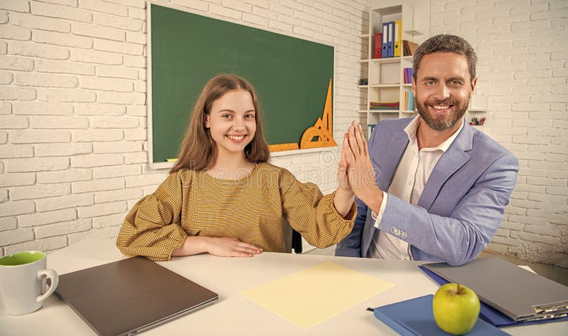 School Education. Happy Child Study in Classroom with Tutor. Give Five ...