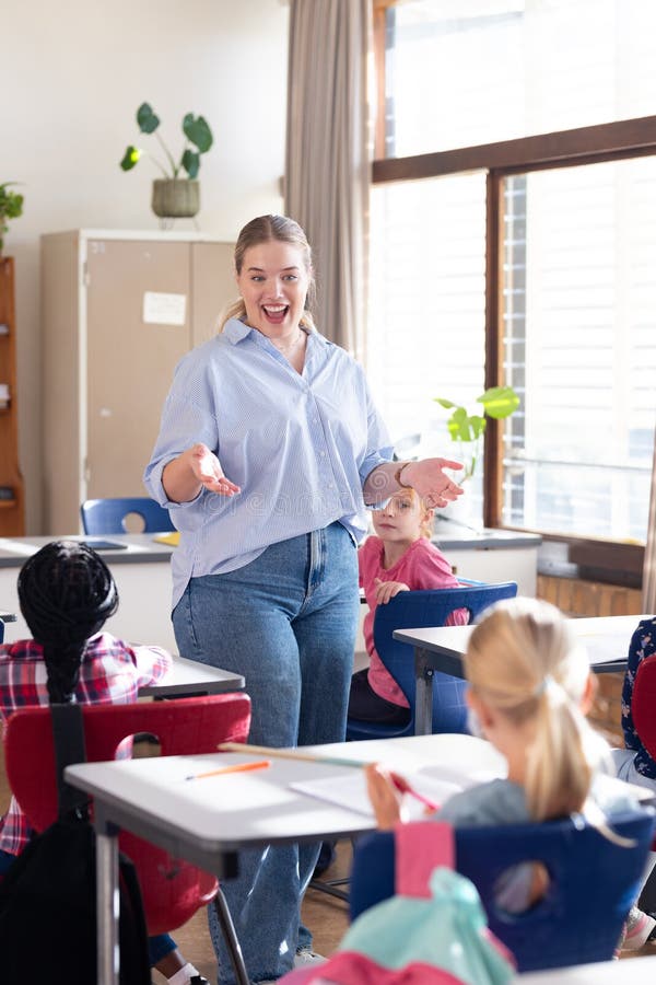 School Female Teacher Engaging Diverse Students Classroom Smiling ...