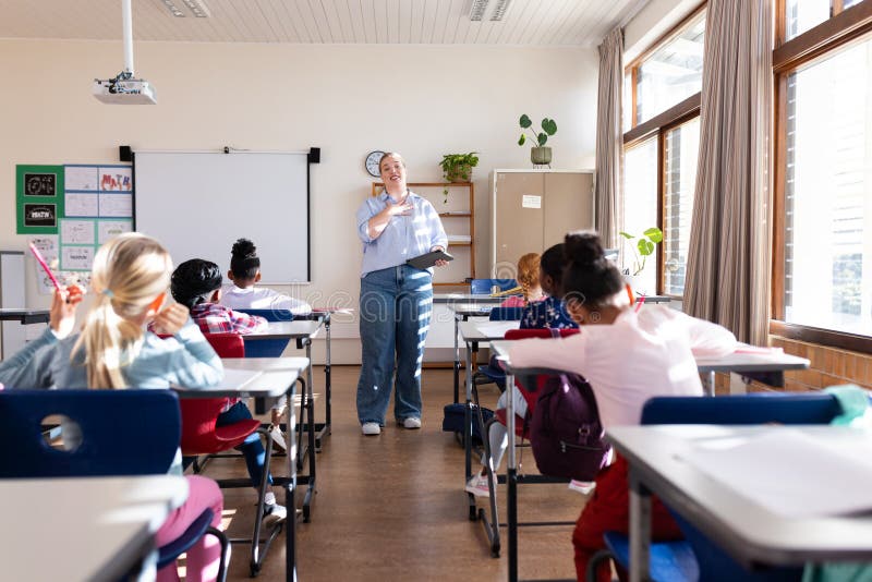 School Female Teacher Instructing Diverse Group Students Classroom ...