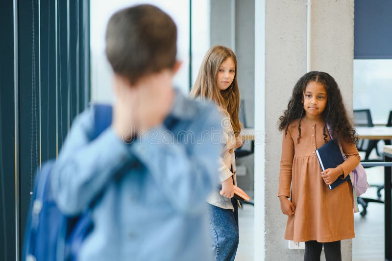 School Friends Bullying a Sad Boy in Corridor at School Stock Image ...