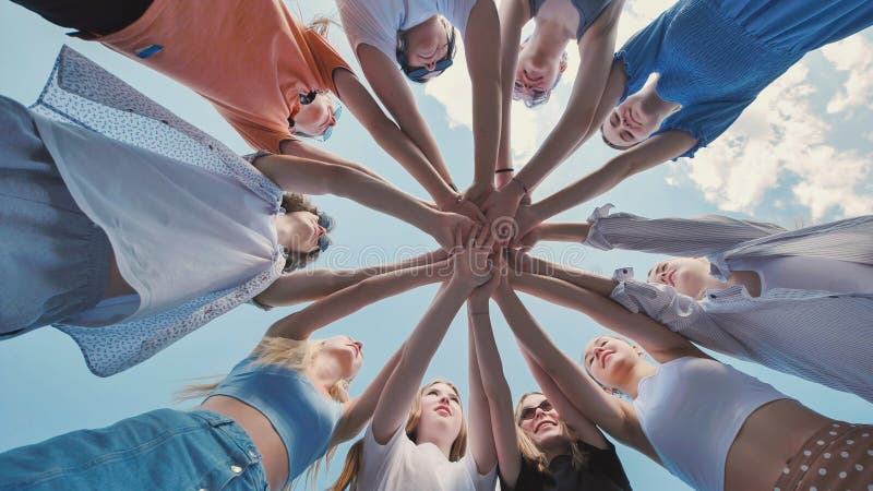 School Friends Joining Hands in a Circle Against a Clear Blue Sky ...