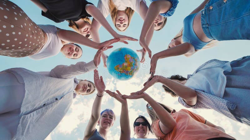 School Friends Joining Hands in a Circle Around a Globe, Representing Unity, Environmental ...