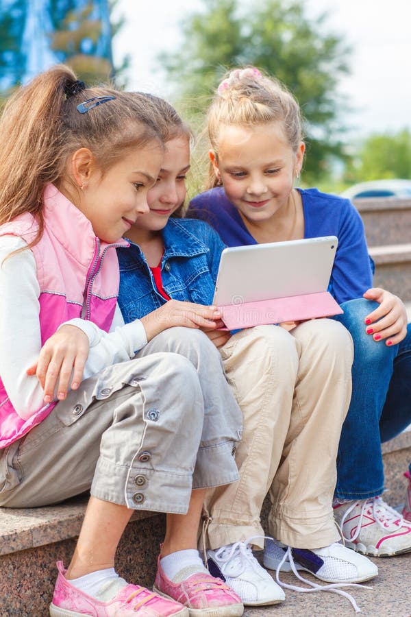 School Friends with a Tablet Device Stock Image - Image of laughing ...
