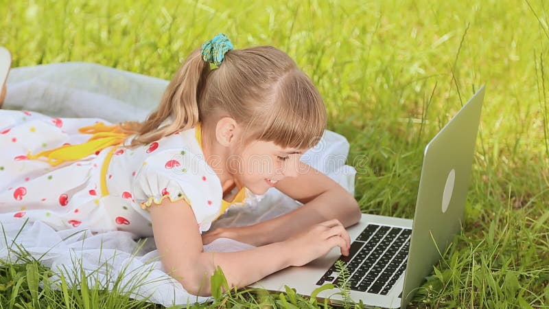Girl with Laptop Outdoors on the Grass Stock Footage - Video of ...