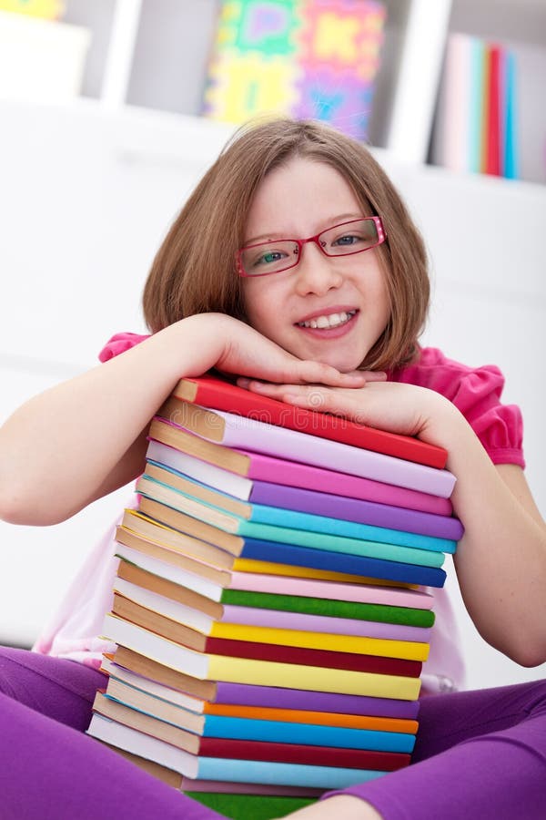 School Child Holding Stack of Books. Stock Photo - Image of books ...