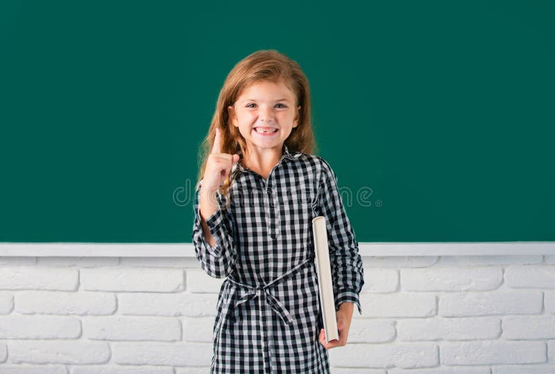 School Girl with Pointing Finger Studying Math on Lesson in Classroom ...