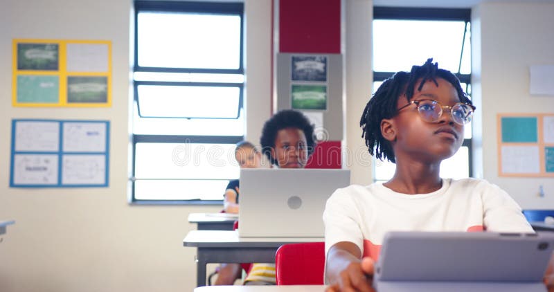 In School, Girl Students Using Laptops and Tablets in Classroom ...