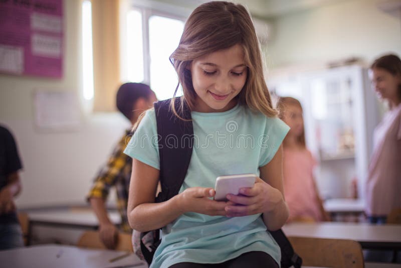School Girl Typing on Her Smart Phone Stock Photo - Image of learning ...
