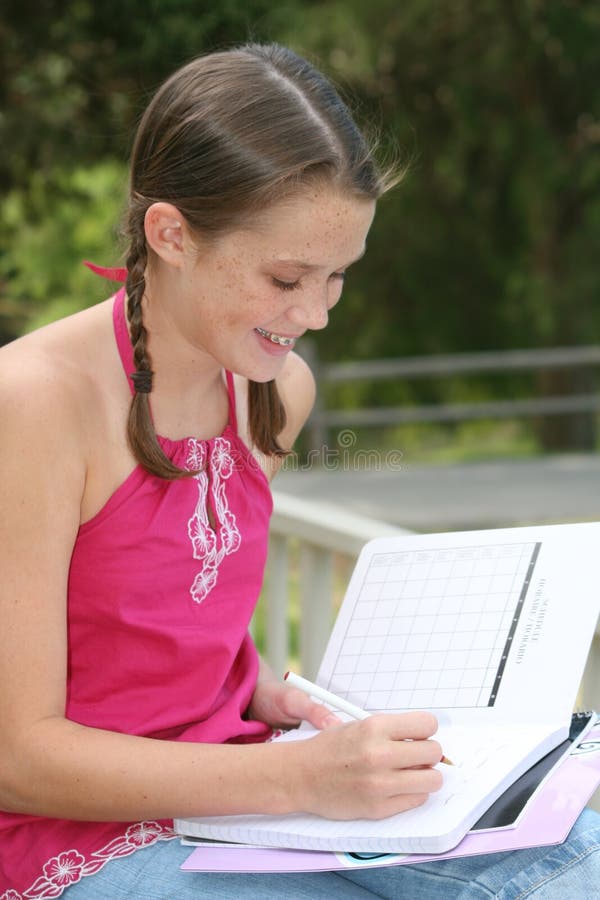 School GIrl Writing in Notebook Outdoors Stock Photo - Image of female ...