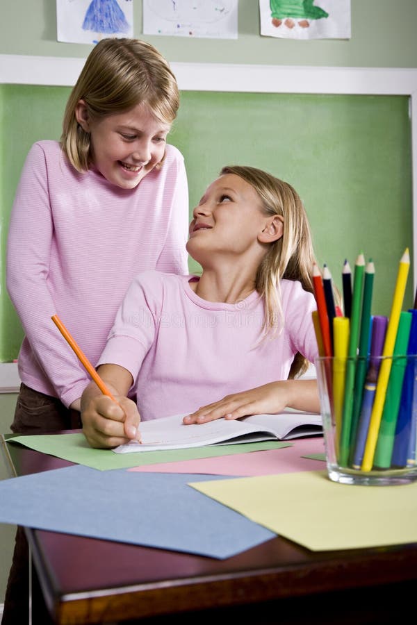 School Girls Writing in Notebook in Classroom Stock Photo - Image of ...