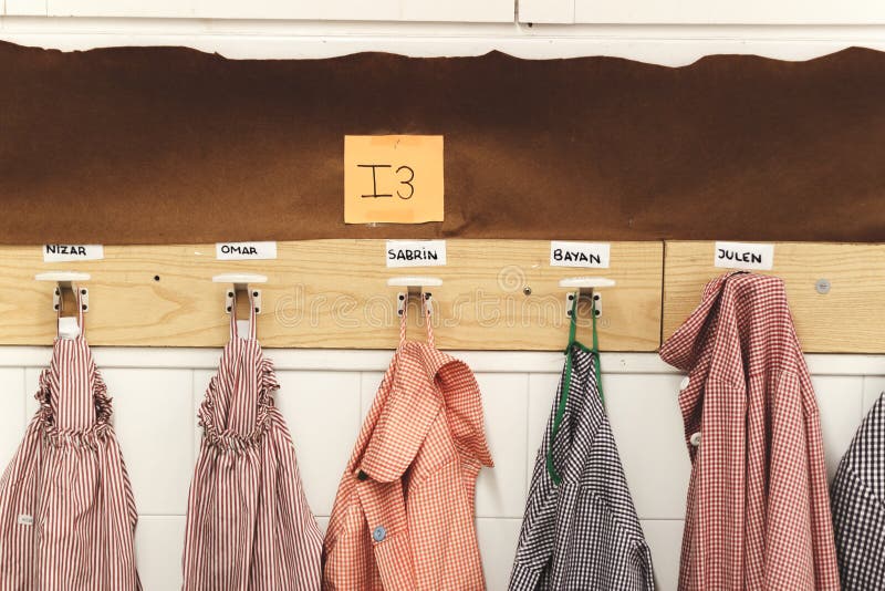 School Gowns on a Rack in a School. Stock Image - Image of store ...