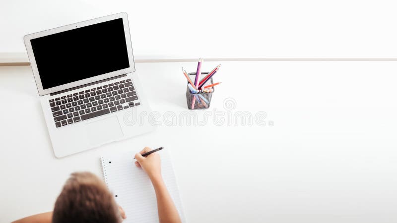 A School at Home through Online Homeschooling. the Child is Sitting at ...