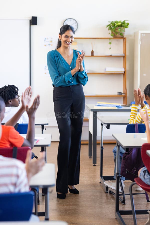 In School, Indian Female Teacher Clapping and Smiling while Students ...