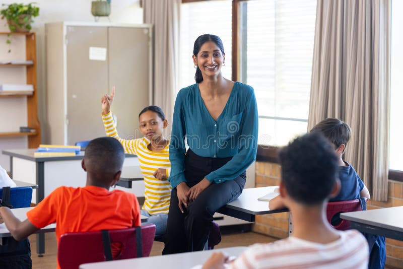 In School, Indian Female Teacher in Lab Coat Pointing at Student in ...