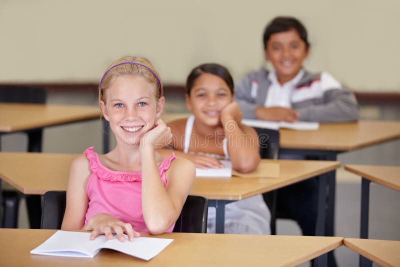 School is always Interesting. School Children Sitting at Their Desk ...