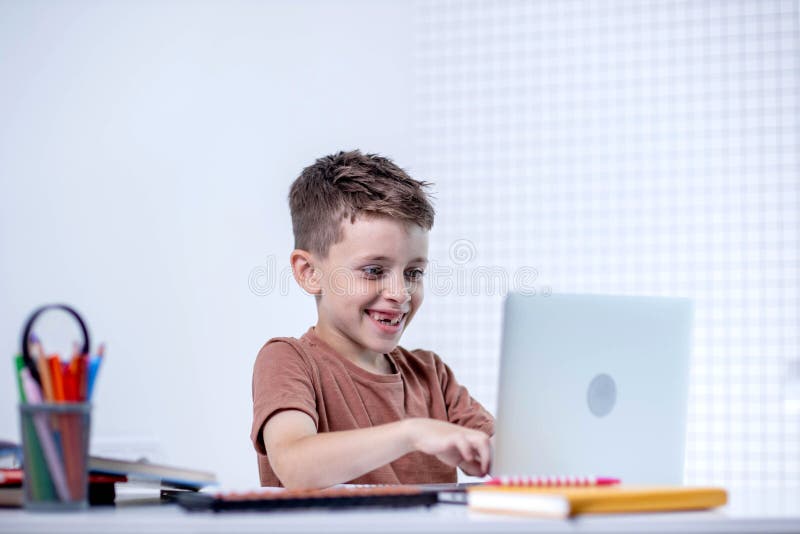 School Kid with Computer Having Video Conference Chat with Teacher and ...