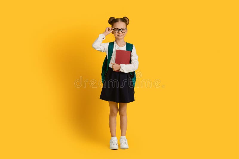 School Kid. Portrait of Cute Little Girl with Backpack and Workbooks ... School Kid. Portrait of Cute Little Girl with Backpack and Workbooks ...