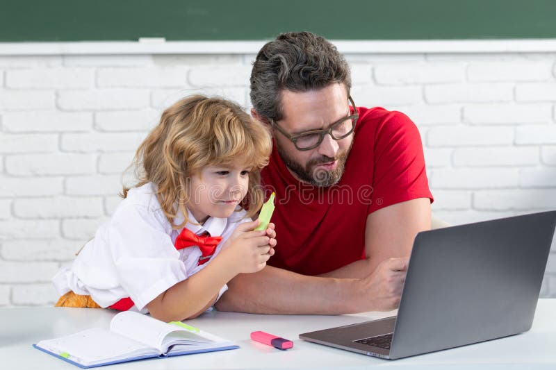 School Kid and Teacher Learning Study in Class. Elementary School Boy ...