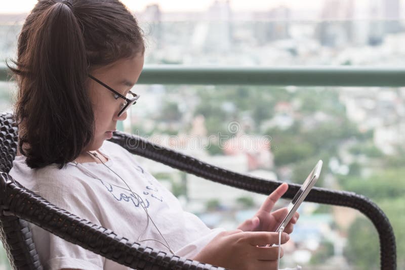 School Kid Using Internet Online Learning and Reading E-book on Mobile ...