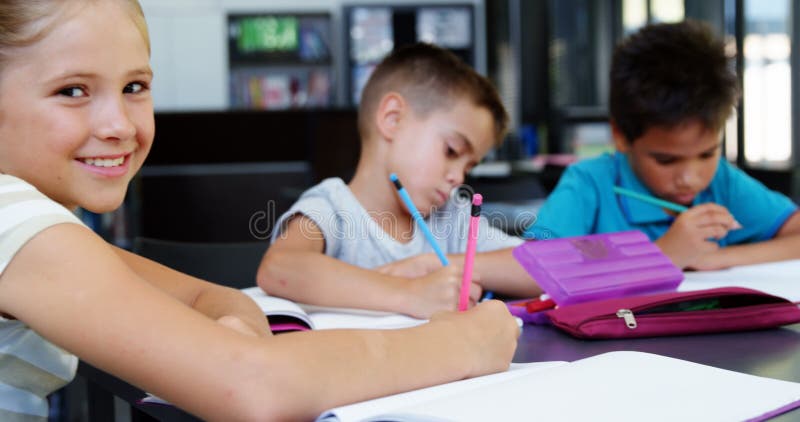 School Kids Doing Homework in Classroom Stock Video - Video of ...