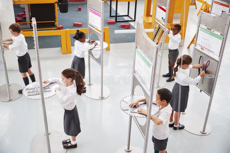 School Kids and Teacher Watch Experiment at a Science Centre Stock ...