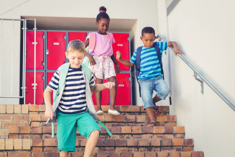 School Kids Getting Down from Staircase Stock Photo - Image of ...