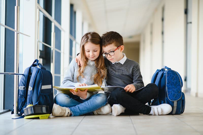School Kids Reading Book Together in Corridor. Conception of Education ...