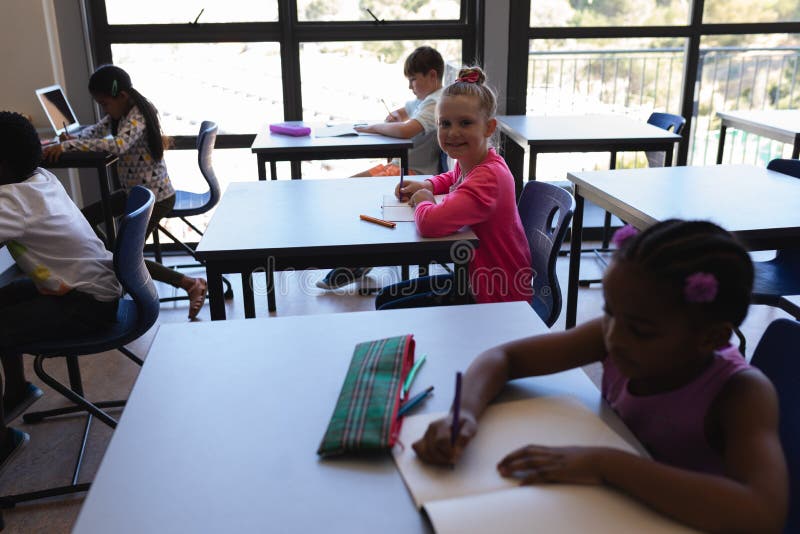 School Kids Sitting and Working in Classroom Stock Image - Image of ...