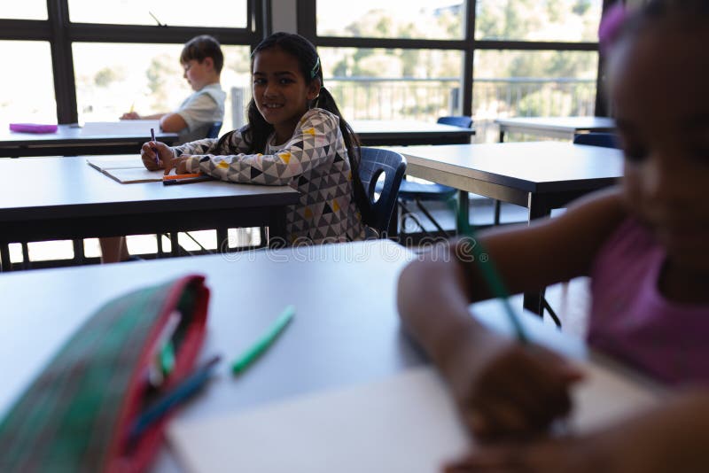 Side View of School Kids Standing in Row with Their Hands on Shoulder ...