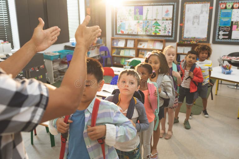 School Kids Standing and Forming a Queue in Classroom at School Stock ...