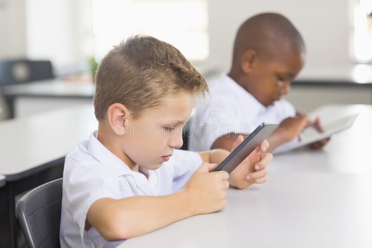 School Kids Using Digital Tablet in Classroom Stock Image - Image of ...